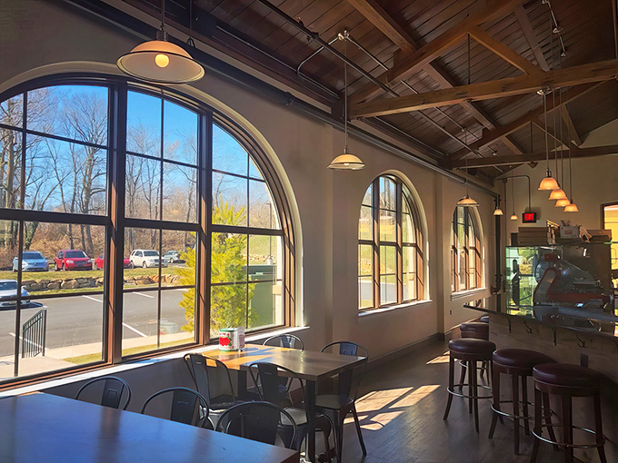 Those arched windows flood the space with natural light, making every pizza look like it's ready for its Instagram moment.