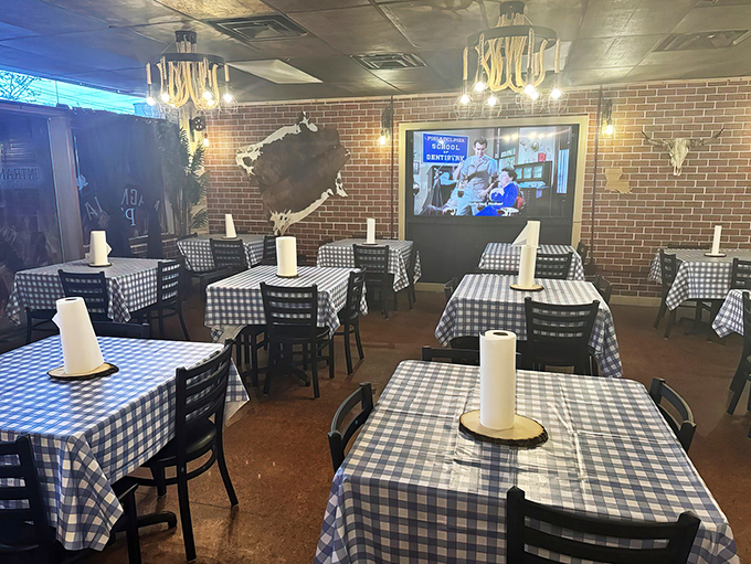 The dining room's rustic-chic vibe with TVs for entertainment&mdash;because good barbecue deserves your full attention, but sports are important too.