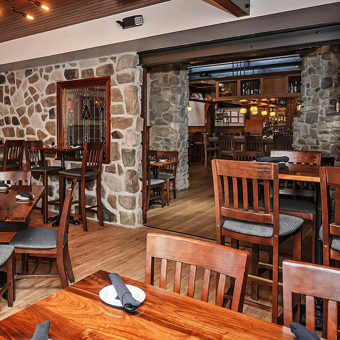 Stone walls that could tell stories meet wooden tables that have hosted countless celebrations&mdash;this room practically radiates contentment.