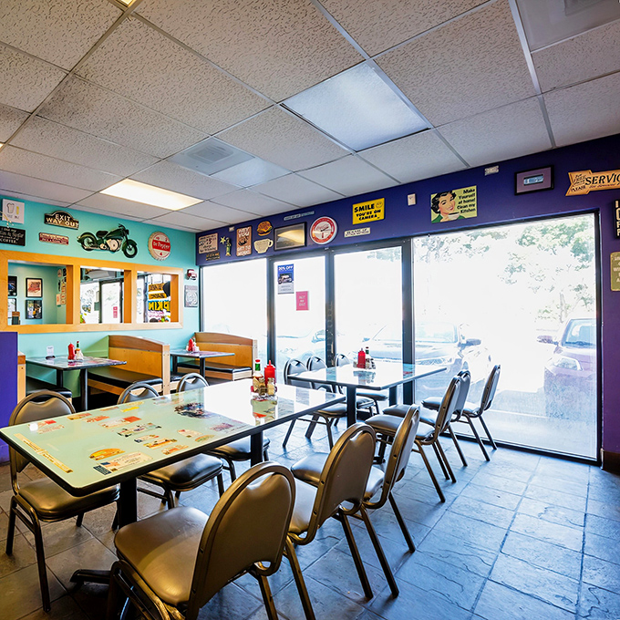 Classic diner aesthetics with those teal walls, vintage signs, and comfortable booths&mdash;the visual equivalent of a warm hug from your favorite aunt.