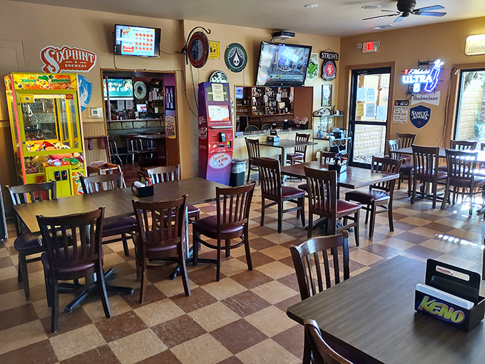 The dining area strikes that perfect balance between "been here forever" and "feels like home" with its wood-paneled walls and neon beer signs.