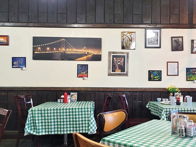 Green checkered tablecloths and local art create the backdrop for countless conversations. These tables have heard more Omaha stories than any therapist in town.