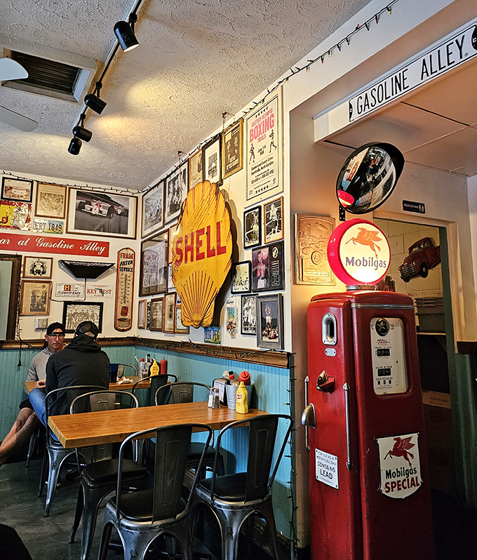 Vintage gas station memorabilia and a classic red pump transform an ordinary meal into a journey through America's roadside history.