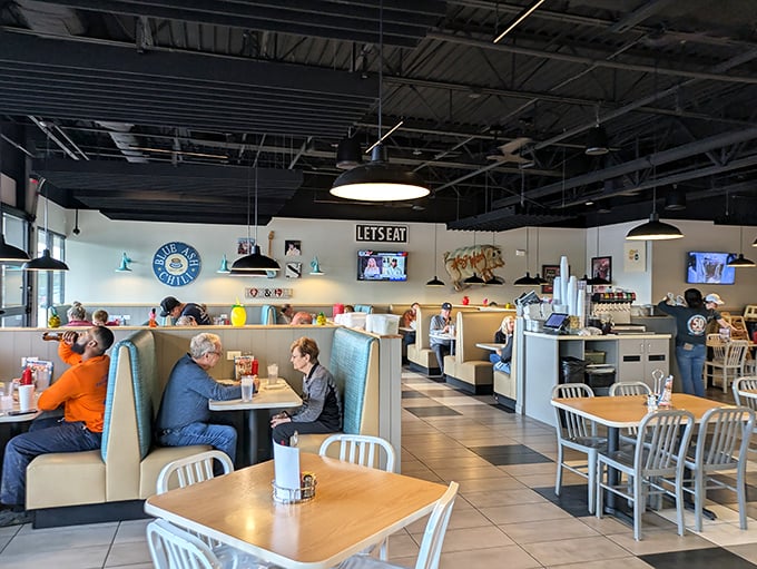 The dining area hums with the universal language of people united in their pursuit of serious comfort food.