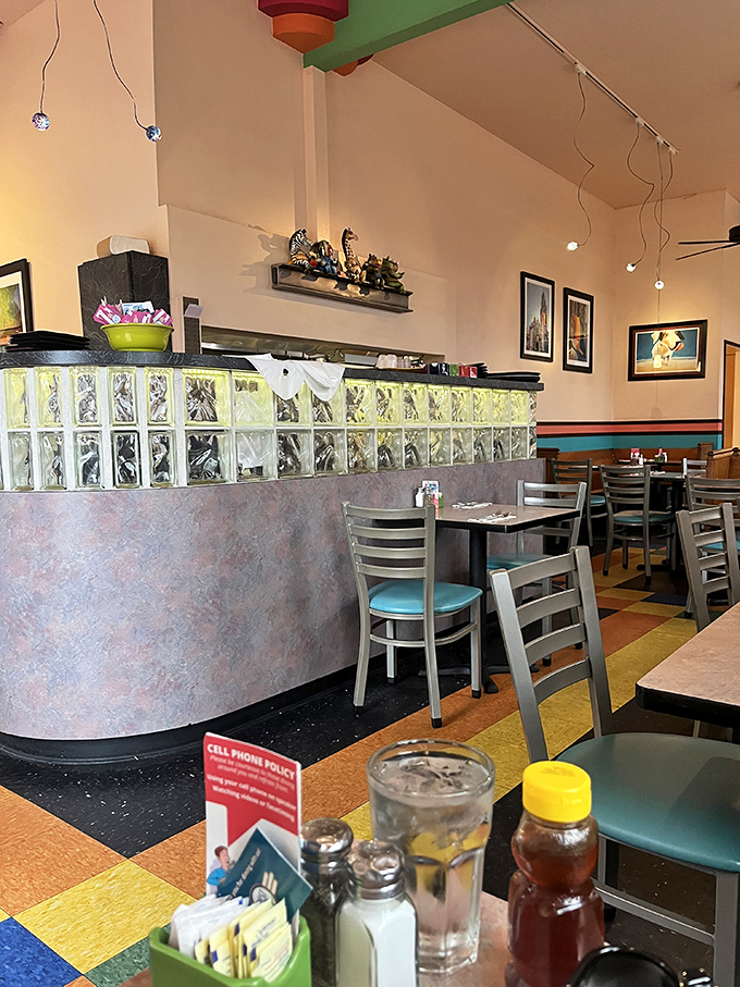 Glass block counter curves like a mid-century spaceship. The diner's architectural details make waiting for your food part of the experience.