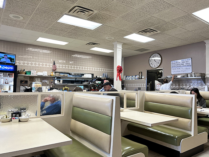 The quintessential diner experience: open kitchen, comfortable booths, and that reassuring hum of plates and conversation.