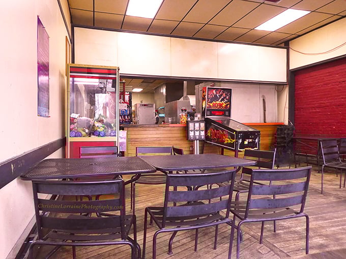 Minimalist dining at its finest&mdash;metal chairs, wooden floors, and the promise of food that will make you forget you're sitting on something less cushioned than your couch.