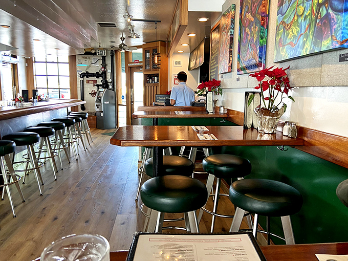 The bar area combines warm wood tones with nautical touches &ndash; the perfect spot to contemplate your next seafood selection.
