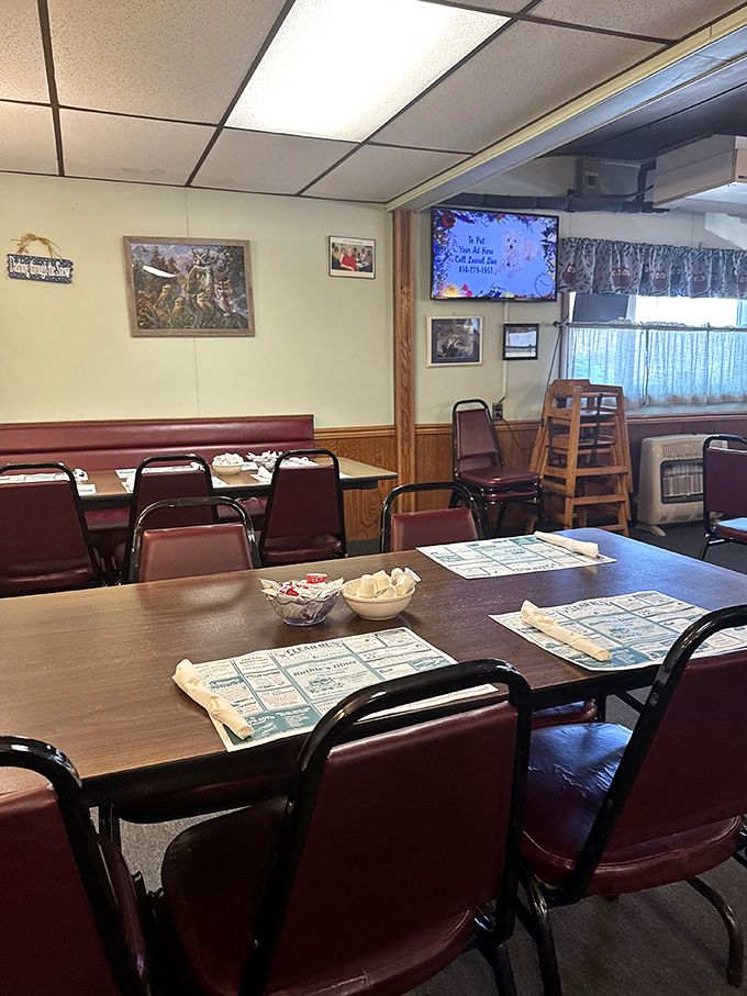 Classic diner seating where strangers become temporary neighbors, sharing nothing but space and an appreciation for honest food.