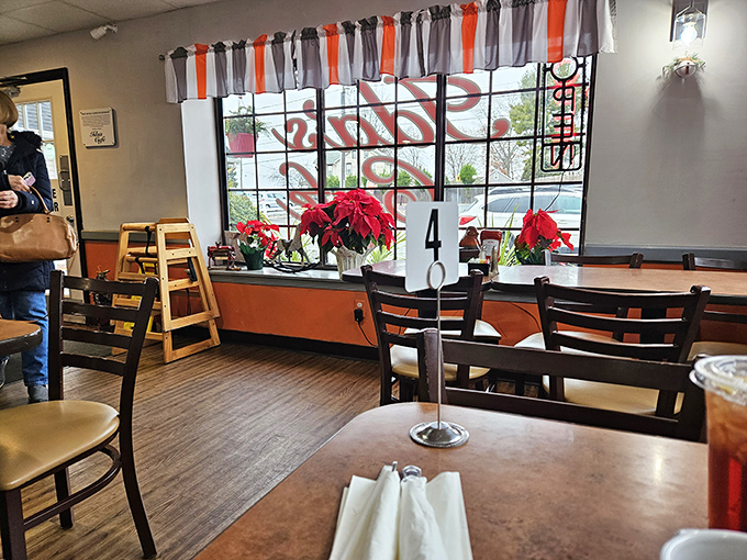 Window seats at Ida's&mdash;where poinsettias add festive cheer and you can people-watch while debating between sweet or savory for your next visit.