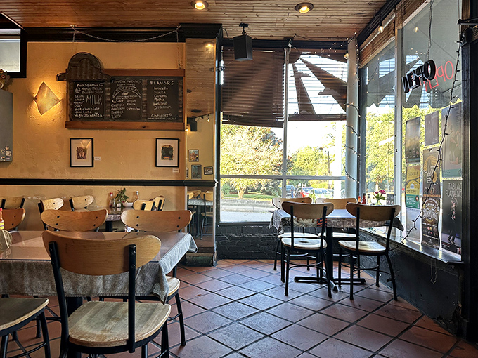 Morning light streams through windows, turning this corner table into prime breakfast real estate that locals know to arrive early for.
