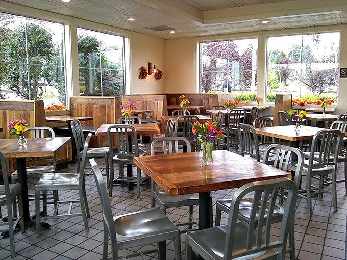 Fresh flowers on wooden tables bring a touch of homey charm. Like eating at a friend's place, if your friend made legendary burgers.