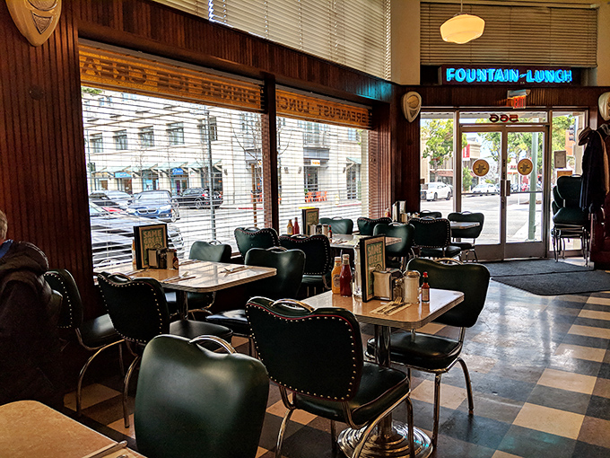Classic diner seating where conversations flow as smoothly as the coffee and memories are made daily.