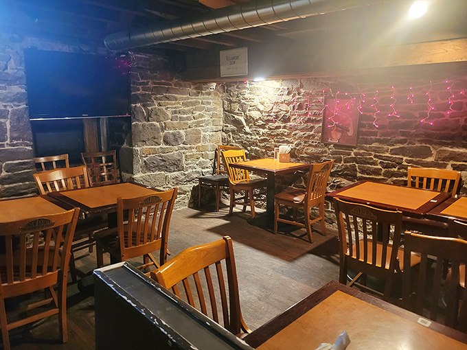 The stone walls downstairs create a cozy den where conversations flow as freely as the beer and nobody checks their phones.