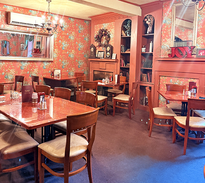 Floral wallpaper and warm wood tones create a dining room that feels like your favorite aunt's house&mdash;if your aunt were an exceptional cook with impeccable taste.