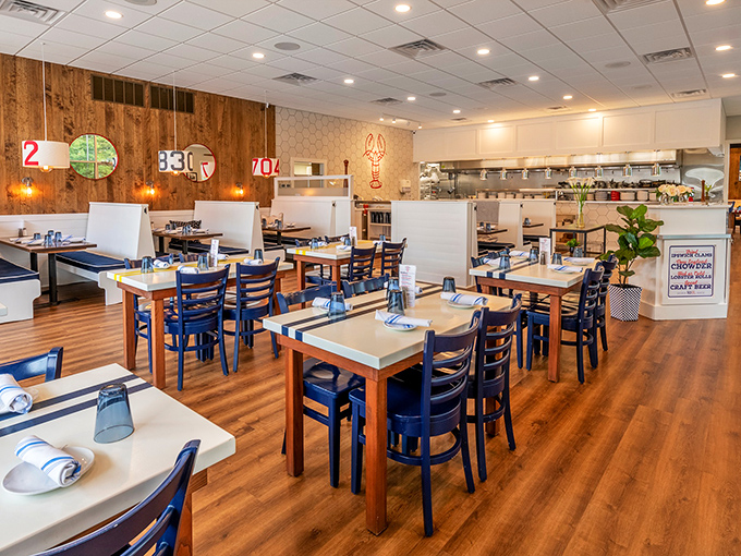 Clean lines, warm wood, and nautical touches create a dining space that feels both contemporary and timeless. Maritime chic without the kitsch.