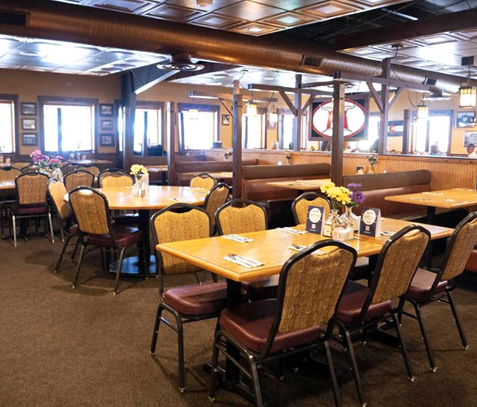 The dining room balances casual comfort with just enough elegance&mdash;those golden chairs have witnessed countless celebrations and first dates.