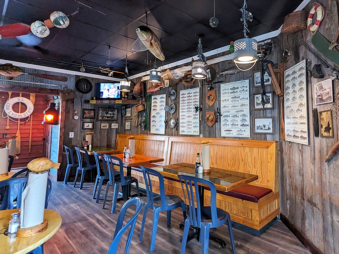 Fishing memorabilia adorns wooden walls while simple tables await hungry travelers. No pretension here&mdash;just a space dedicated to Great Lakes seafood worship.