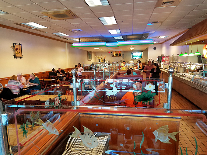 The dining area balances functionality with touches of charm&mdash;those decorative fish tanks saying "Yes, our seafood is fresh, why do you ask?"