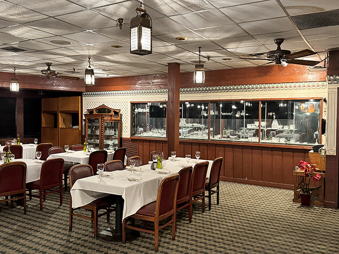 White tablecloths signal "special occasion" while the comfortable chairs whisper "stay awhile." The perfect balance of elegance without pretension.