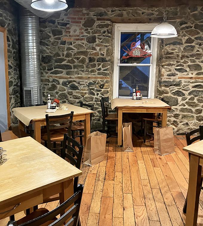 Stone walls and wooden floors create a maritime atmosphere without going overboard on theme. Nautical charm meets practical comfort.