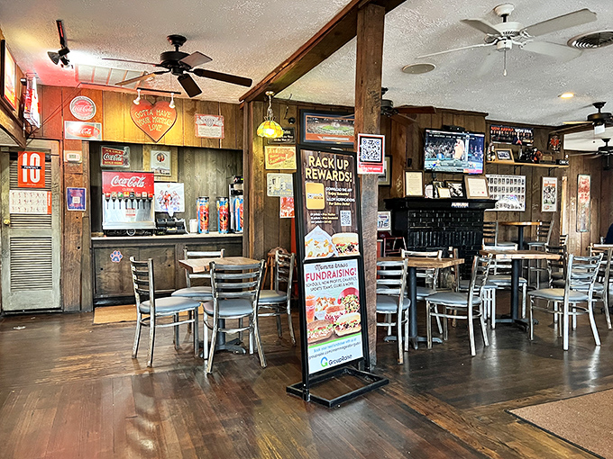 Wood paneling, Coca-Cola signs, and tables that have hosted thousands of conversations—this isn't just dining, it's time travel.