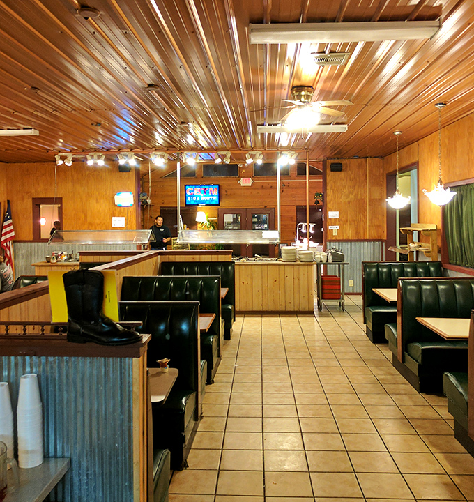 Wood paneling, corrugated metal accents, and comfortable booths create the perfect backdrop for serious eating. This isn't dining&mdash;it's Southern communion.