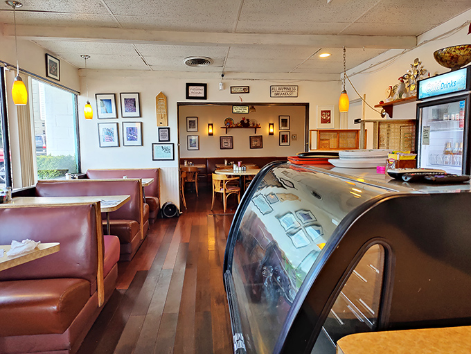 Classic diner booths where countless life decisions have been made, relationships started, and last bites of pie reluctantly surrendered.