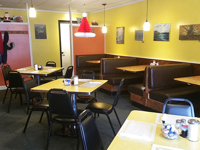 Classic booth seating where countless life decisions have been made over pie and coffee. The yellow walls practically radiate midwestern optimism.