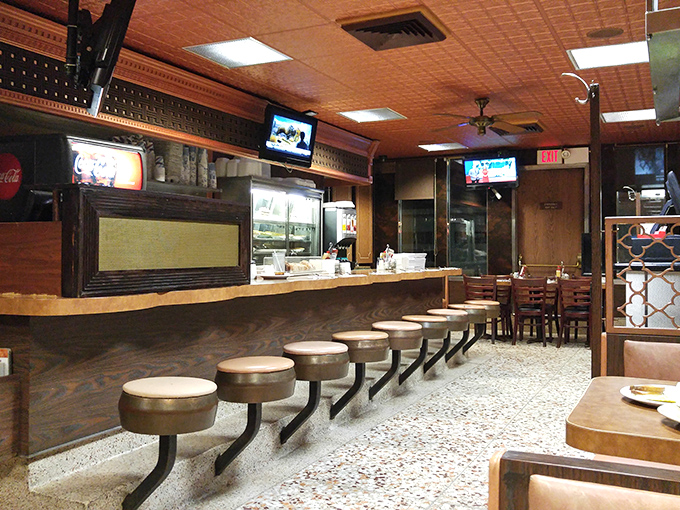 Classic diner aesthetics that haven't changed because they don't need to. Those stools have heard more stories than a bartender.