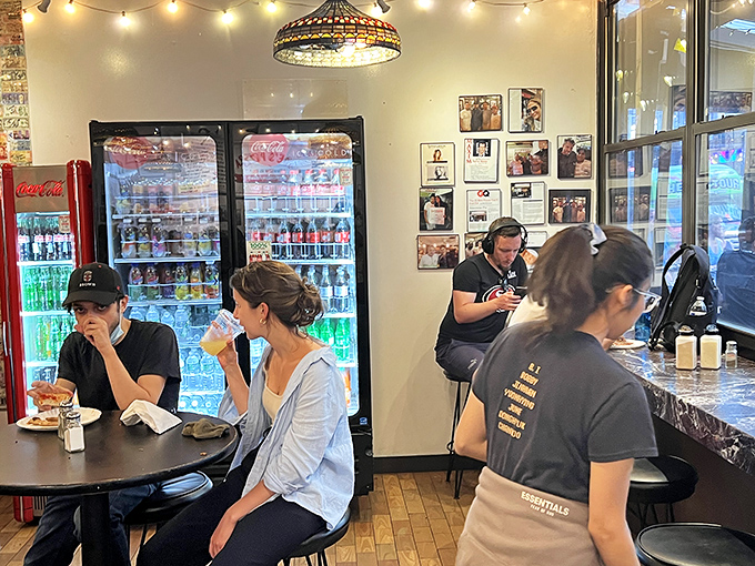 The dining area—where strangers become temporary friends united by the universal language of "this pizza is incredible."