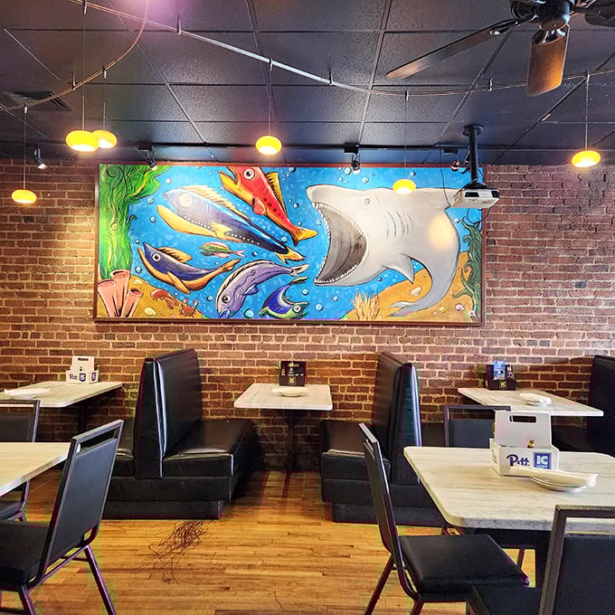 Vibrant underwater artwork watches over diners like a benevolent sea god blessing your seafood feast.