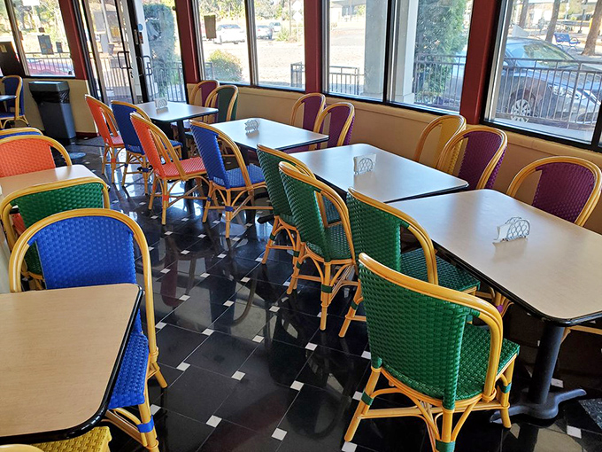 Colorful chairs add a playful touch to the dining room. Like a United Nations of seating, they welcome everyone to the table.