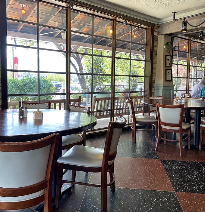 Large windows flood the dining area with natural light, creating the perfect backdrop for both your meal and your inevitable food photos.