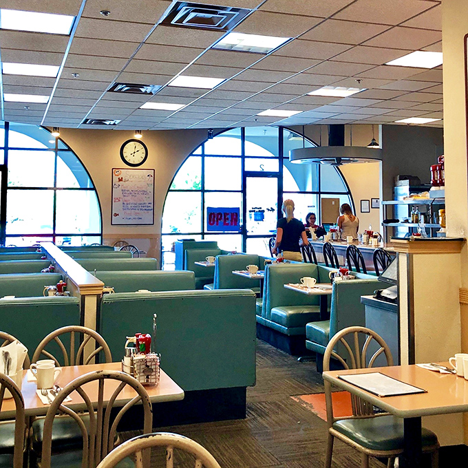 The dining area balances retro charm with modern comfort&mdash;those teal booths have witnessed countless first dates, family reunions, and hangover recoveries.