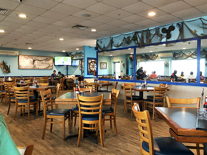 The dining room hums with conversation and clinking glasses, while nautical d&eacute;cor reminds you that your dinner probably swam nearby.