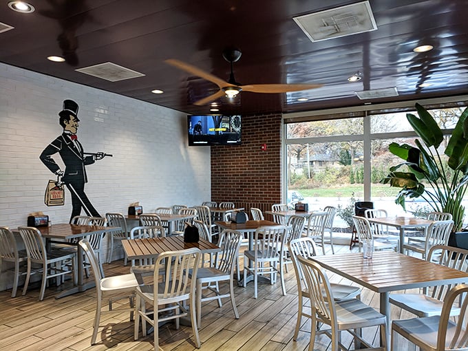 The dining area's gentleman mascot watches over patrons like a dapper barbecue guardian angel, ensuring proper enjoyment of every sauce-laden bite.
