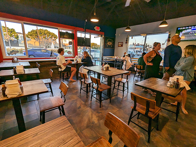 Simple wooden tables and nautical-inspired walls create that rare dining space where both conversation and seafood take center stage.