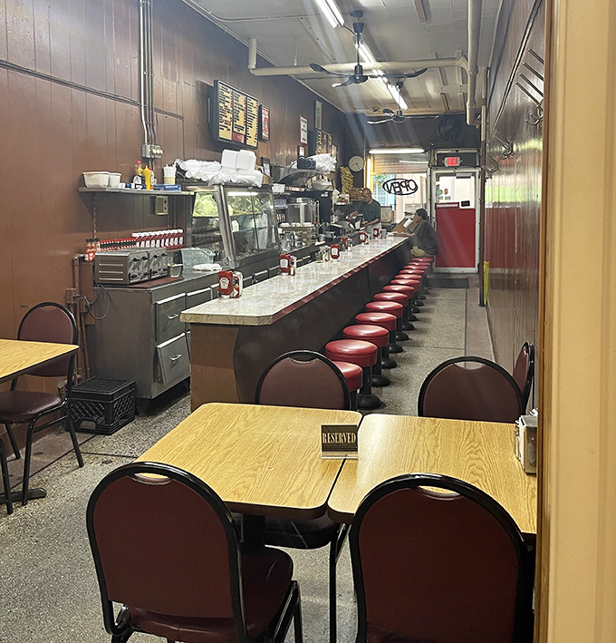 The dining area feels like stepping into a living museum of American restaurant history, where conversations and coffee have flowed for decades.