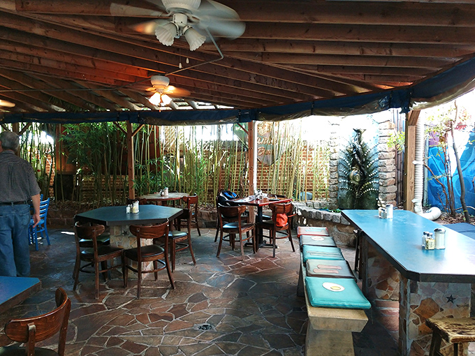 The outdoor patio feels like dining in a secret garden, where stone floors and bamboo create an urban oasis just steps from Atlanta's bustling streets.