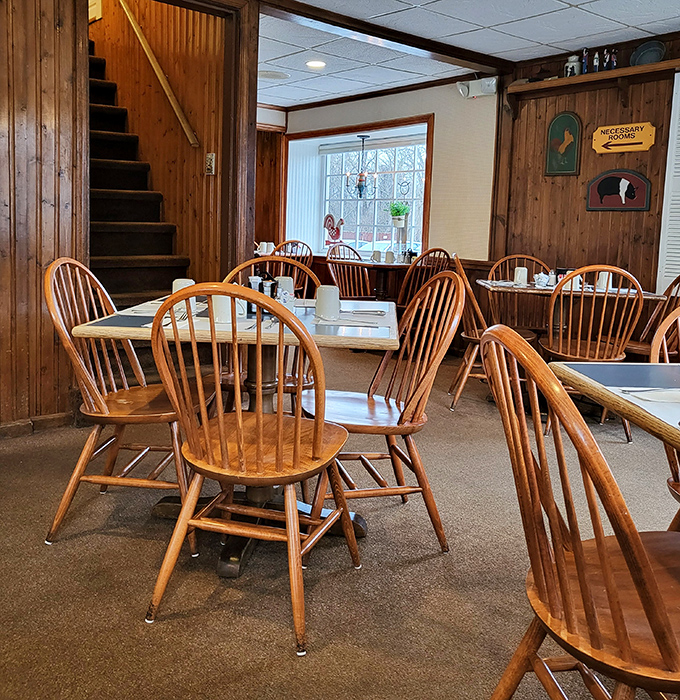 The dining area's wooden staircase and country charm create an atmosphere where strangers become neighbors and calories mysteriously disappear.