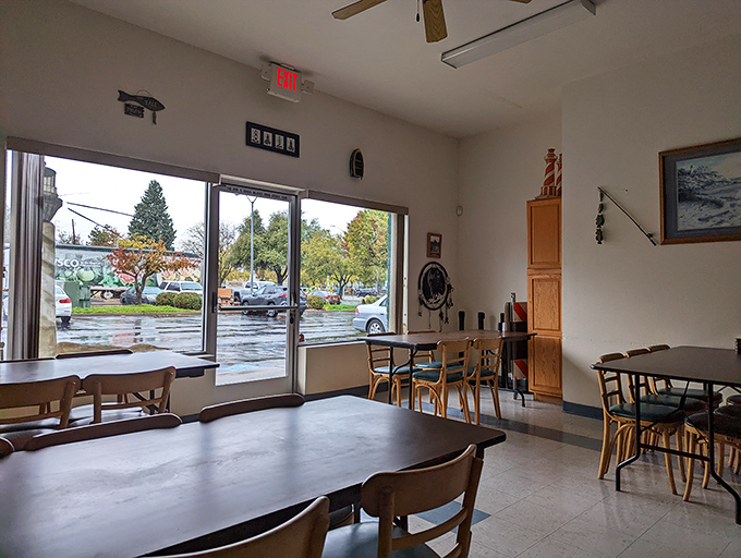 Simple, functional dining space with large windows that flood the room with natural light. Sometimes ambiance is about comfort, not Instagram backdrops.