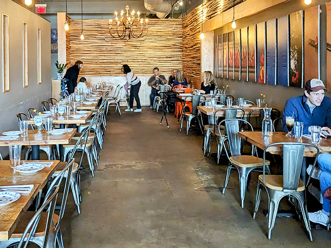 The dining room balances industrial chic with warm wood tones, creating a space where both your hipster nephew and traditional aunt would feel at home.