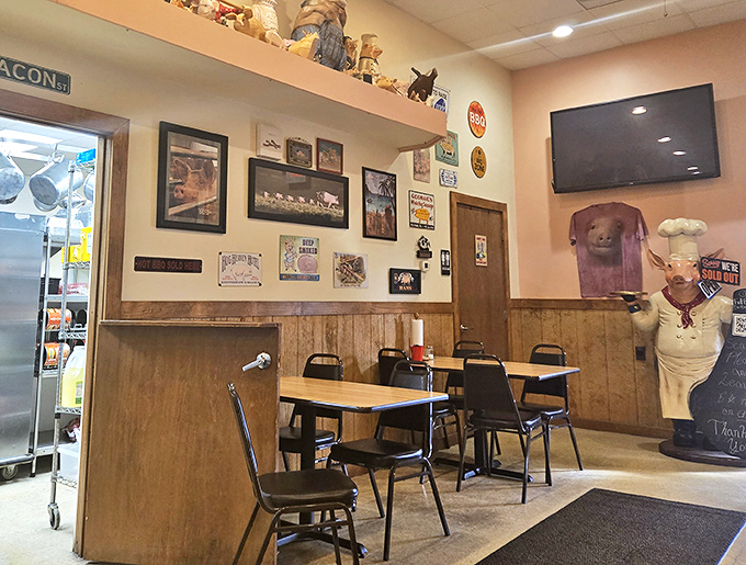 Simple tables, wood paneling, and a pig chef statue&mdash;because when the meat's this good, fancy tablecloths would just get in the way.