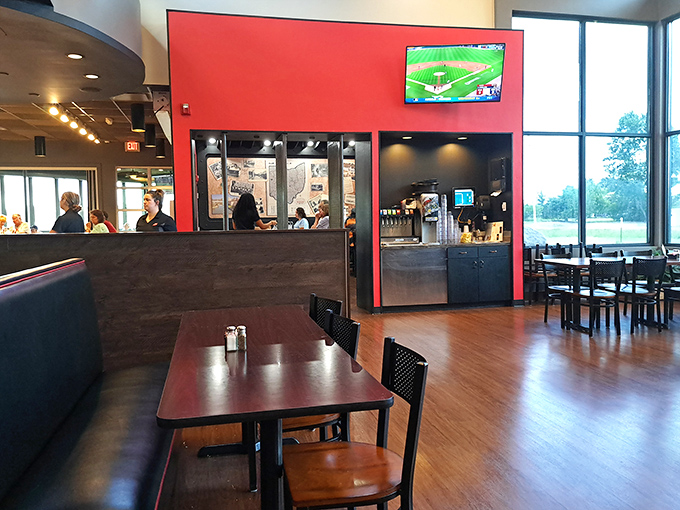 Red accents, warm wood tones, and enough space between tables to keep your conversation about "the best steak you've ever had" somewhat private.