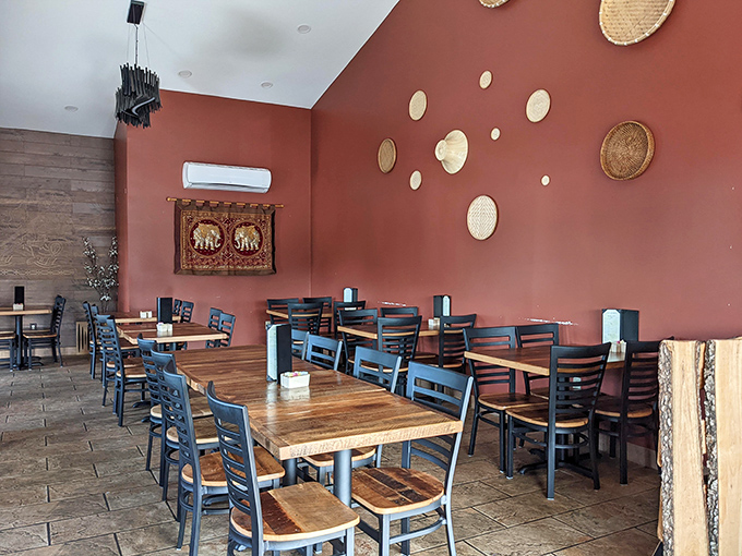 Simple wooden tables against terracotta walls adorned with woven baskets&mdash;the dining room whispers "authentic" without shouting it.