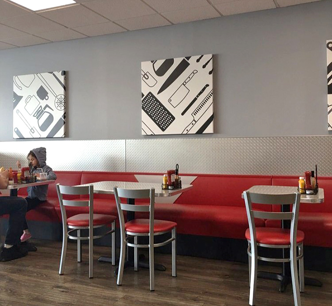Red booths and kitchen-themed art create that perfect diner atmosphere where calories don't count and coffee refills are practically mandatory.