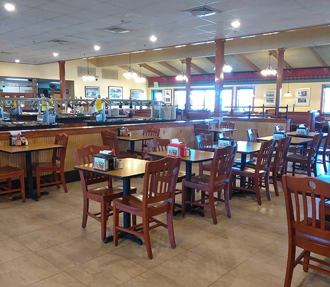 The dining room's warm wood tones and ample seating invite you to settle in for a proper feast.