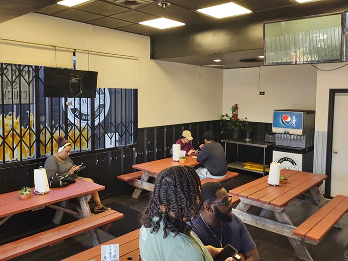 The dining area keeps it simple with picnic tables—because when the food's this good, white tablecloths would just get in the way.