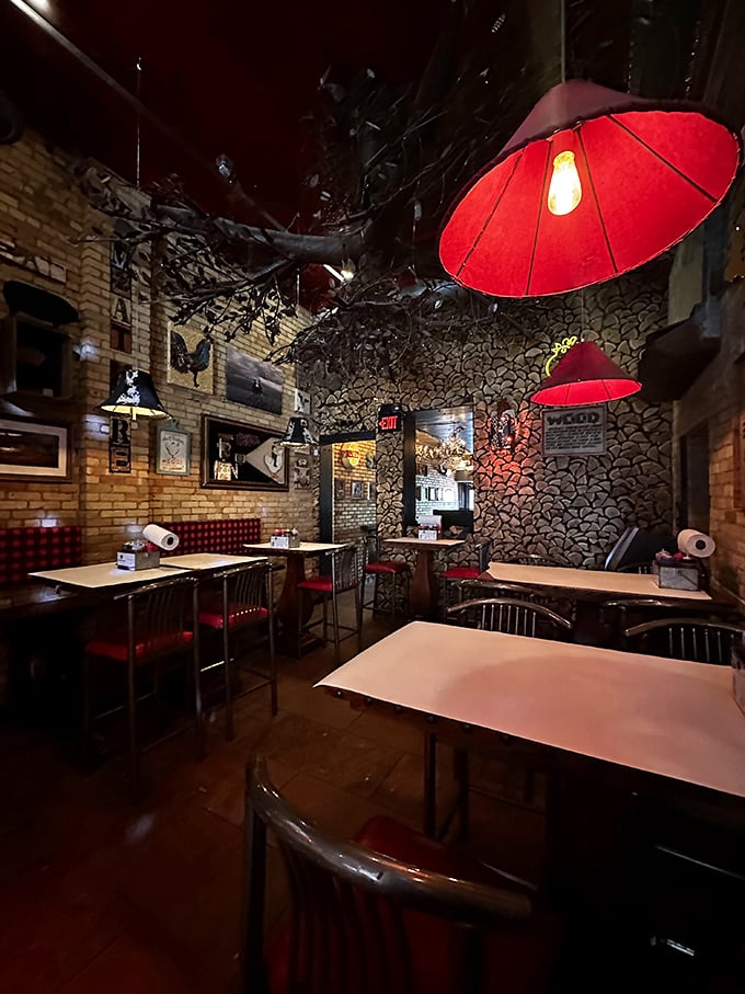 Red lampshades cast a glow that makes everyone look like they're blushing from meat-induced happiness.